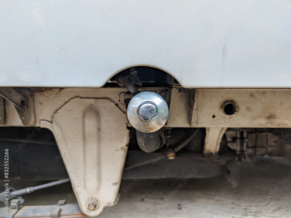 The fuel cap of a pickup car, positioned on the side of the sturdy ...