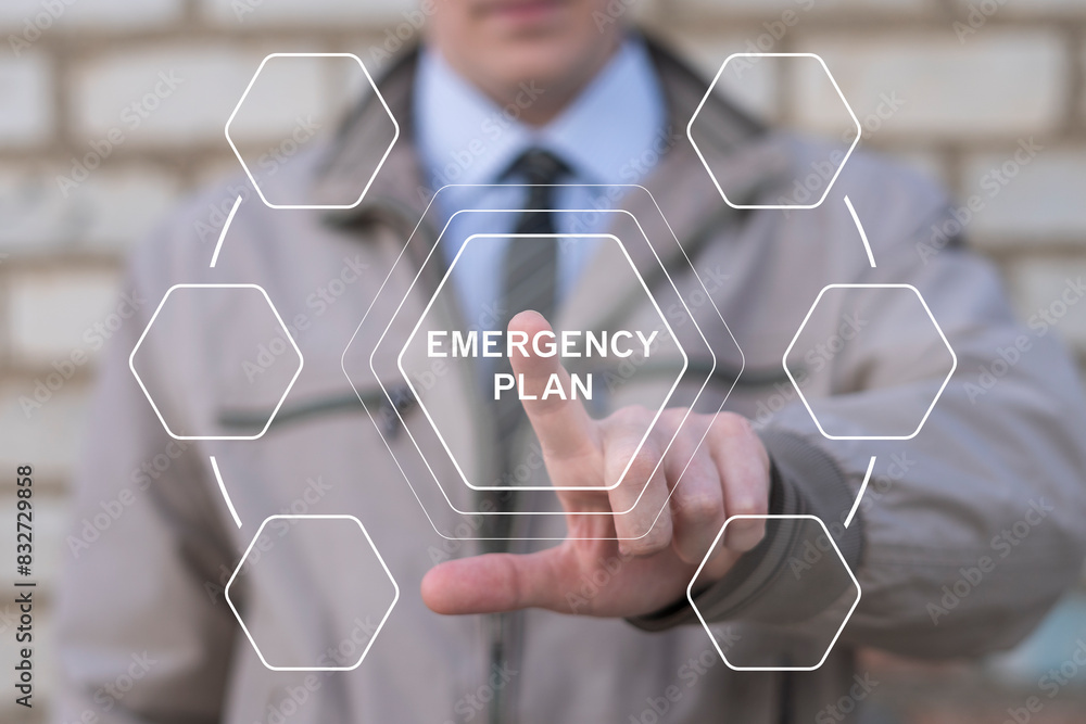 Business man using empty virtual touchscreen presses text: EMERGENCY ...