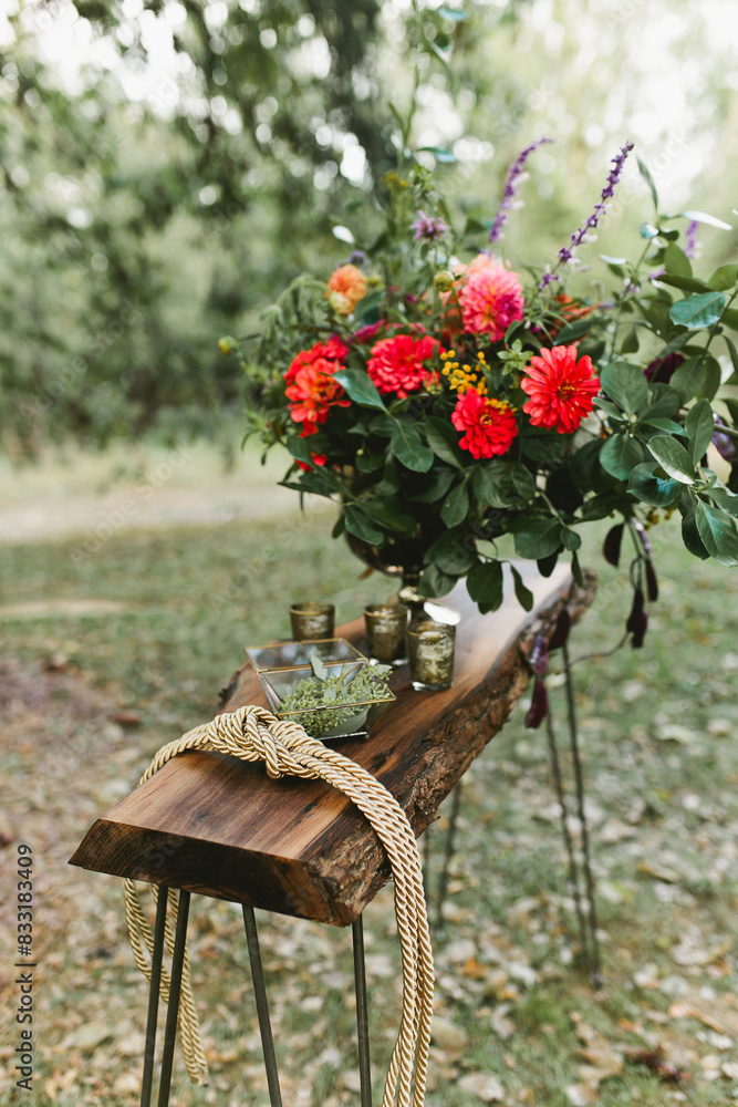 Flower arrangement at wedding with tie the knot rope and glass box ...