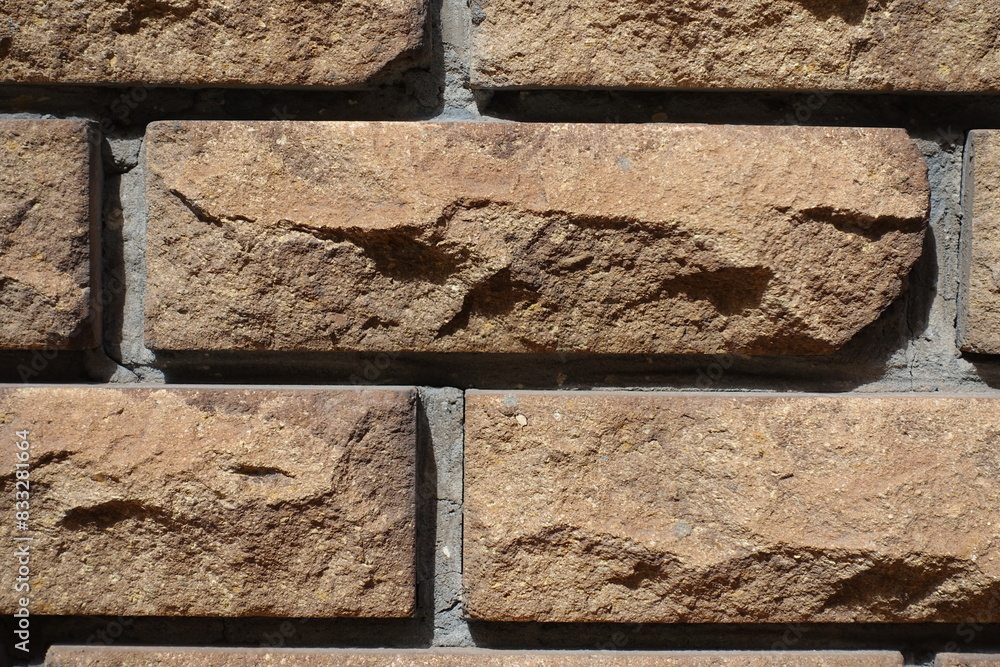 Macro of brown split face brick veneer wall with stretcher bond pattern ...