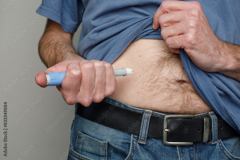 Man making Injection in her Stomach. Semaglutide or Insulin Injection ...