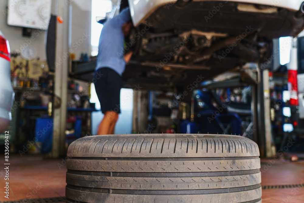 Replacing summer tires for winter using pneumatic wrench tool by ...