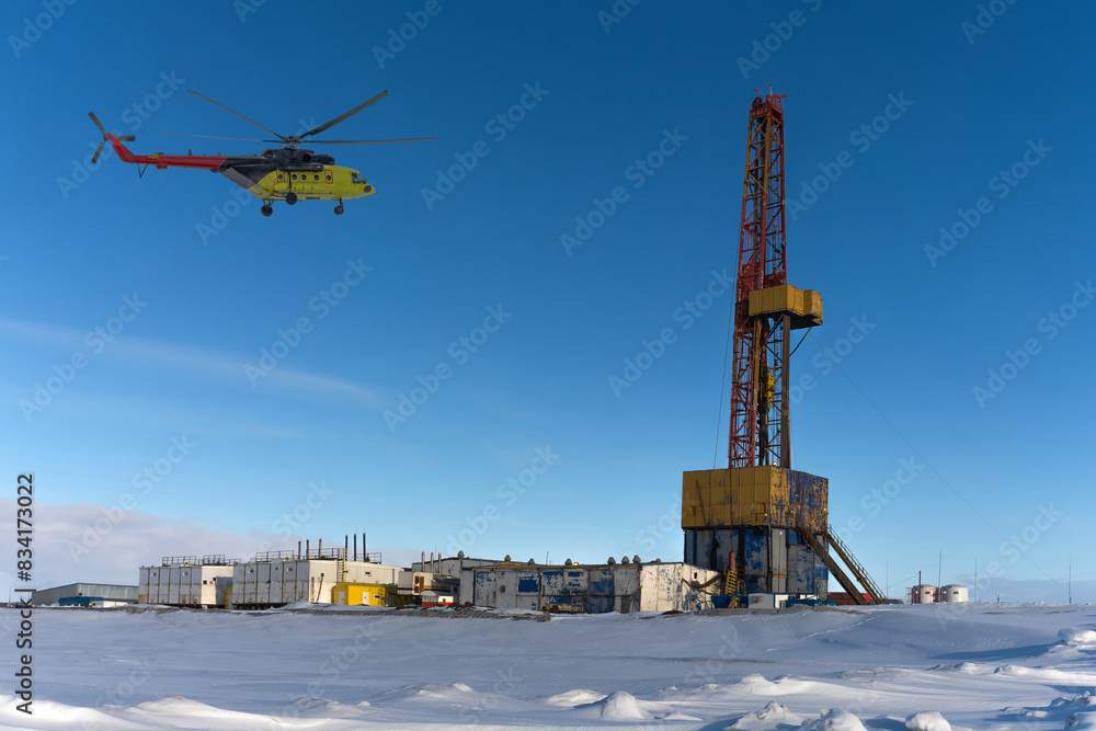 Drilling derrick and well drilling infrastructure in the northern oil ...