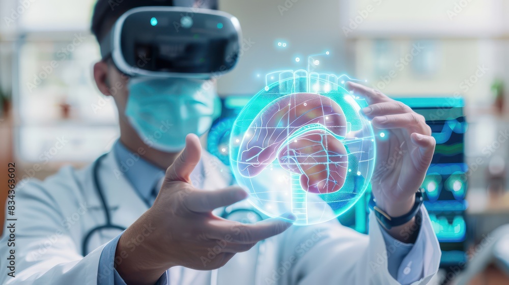 A holographic liver model being manipulated by a doctor wearing ...