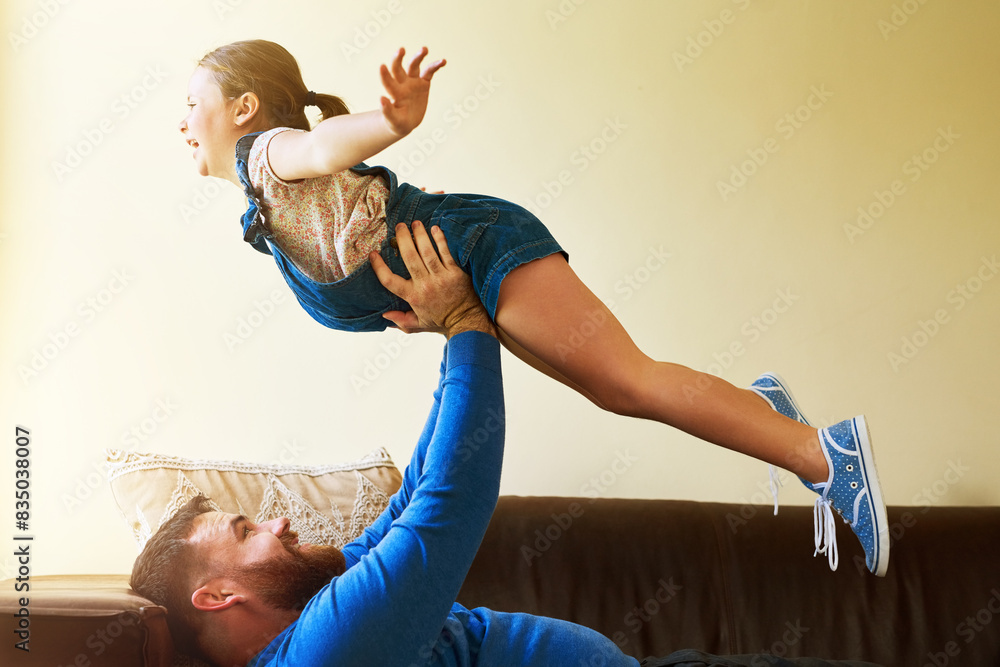 Dad, happy and lifting child with father and girl on sofa in living ...