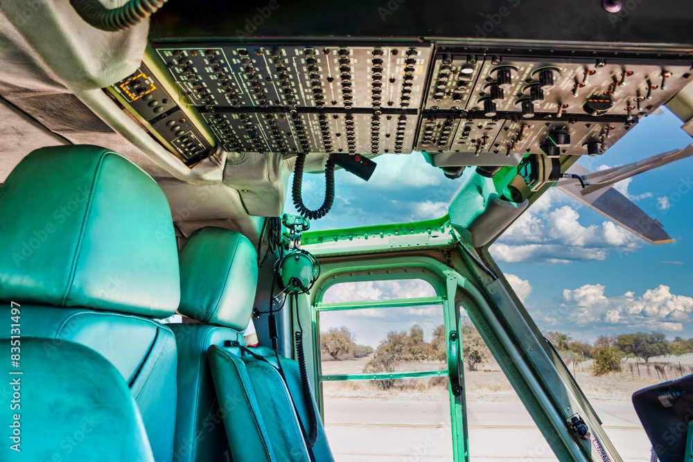 dials and gauges in a helicopter plane cockpit, radio earphones and ...