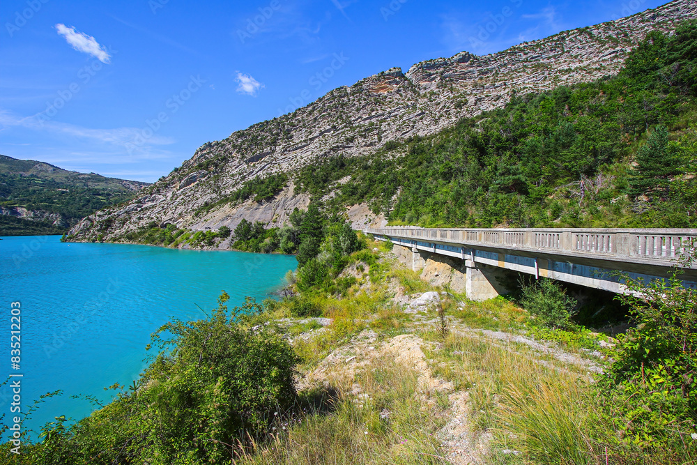 Road bridge parallel to the shore of the Lake of Castillon in the ...