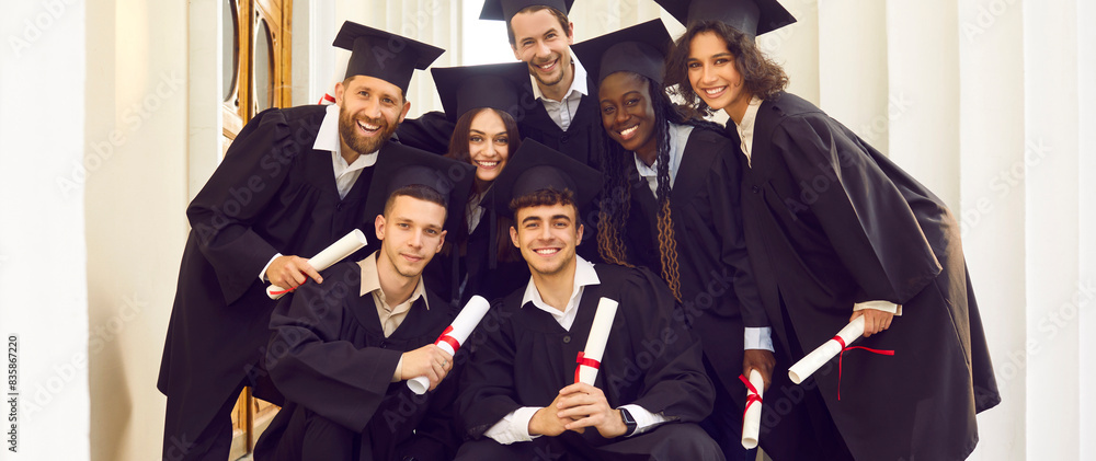Portrait of a smiling happy multiracial international graduates ...
