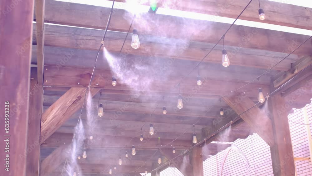 Water spray system for cooling the terrace on a hot summer day. Fogging ...