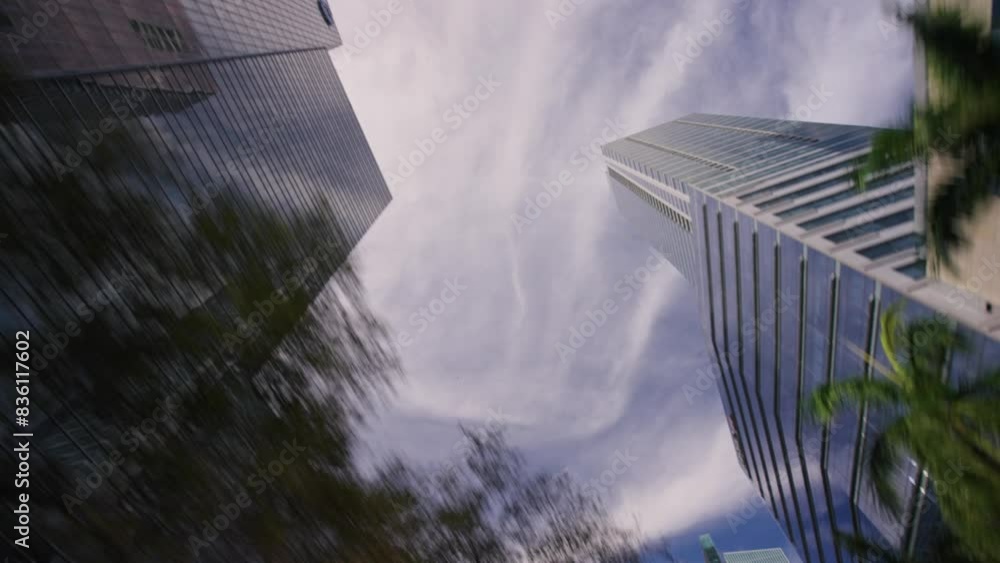 Low angle looking up point of view driving a car on the streets of ...