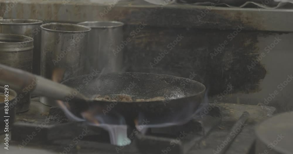 Man cooking street food Biryani on a busy street. Slow motion Biryani ...