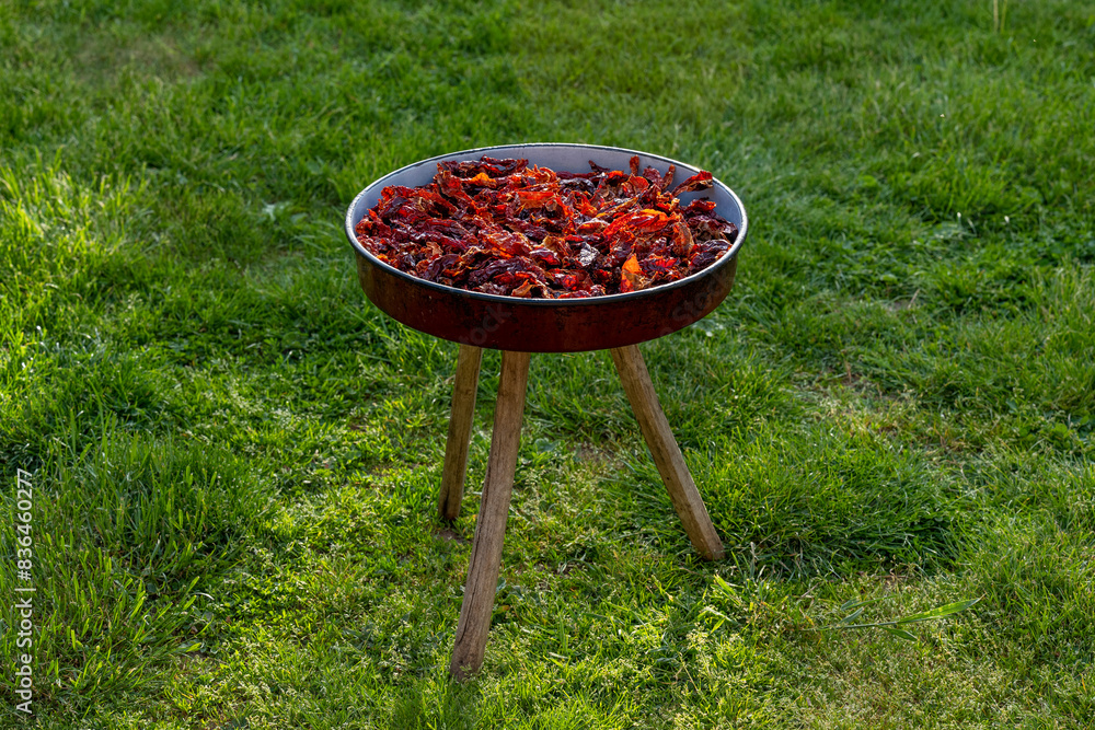 A full red casserole of red dried chili peppers that show off the ...