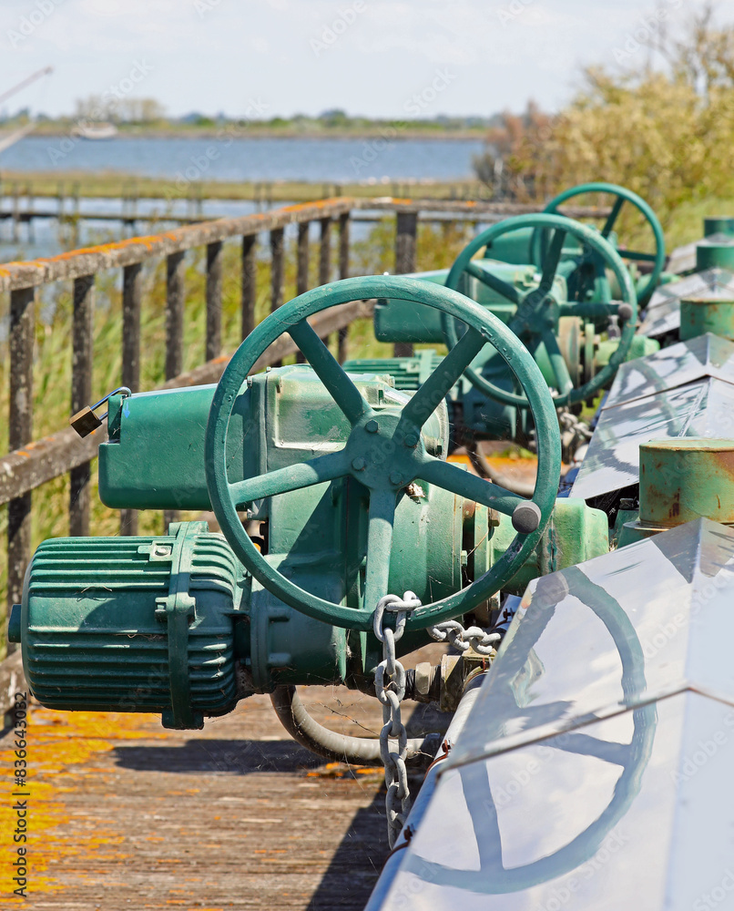 Industrial motorized sluice gates to regulate water flow in marshy ...