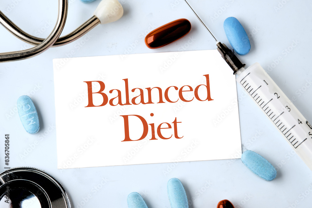 Concept Balanced Diet. text written on a business card on a blue ...