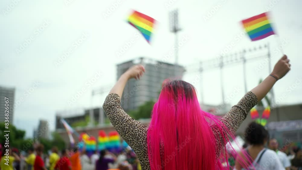 Back view Celebration moment LGBTQ female with pink hair on Pride month ...