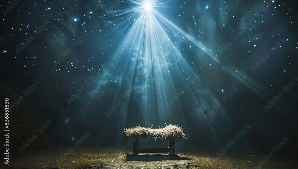 Christmas Nativity scene with an empty manger and a guiding star in a ...