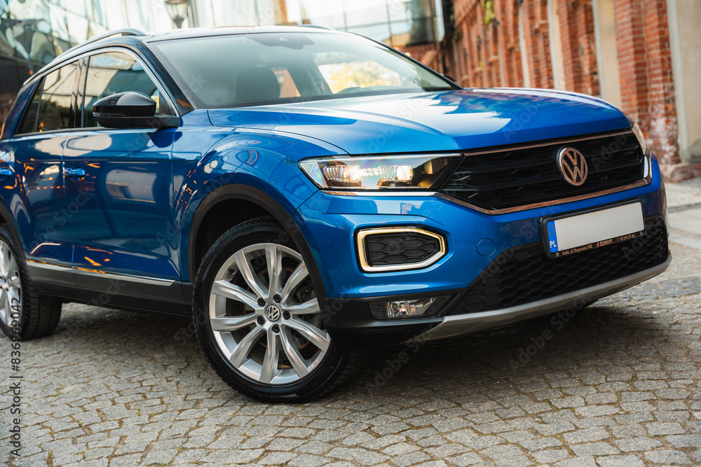 Photo of a blue Volkswagen T-Roc. They show details of the car. Rims ...