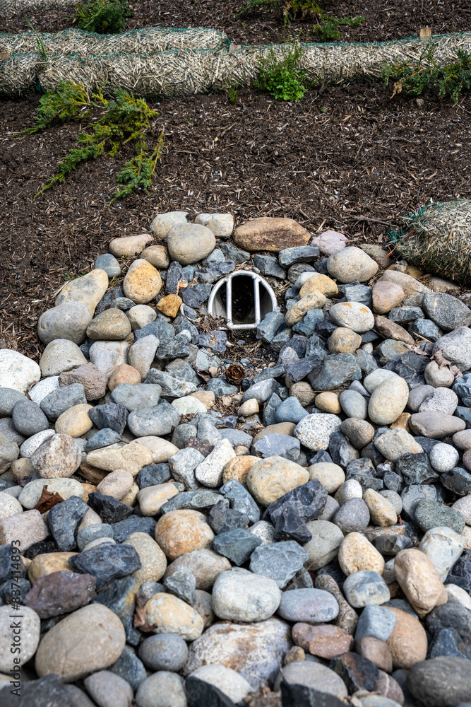 New installation of storm water flood management, round outflow pipe ...