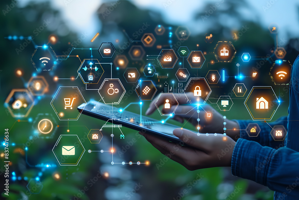 Person using a digital tablet with futuristic icons overlay ...