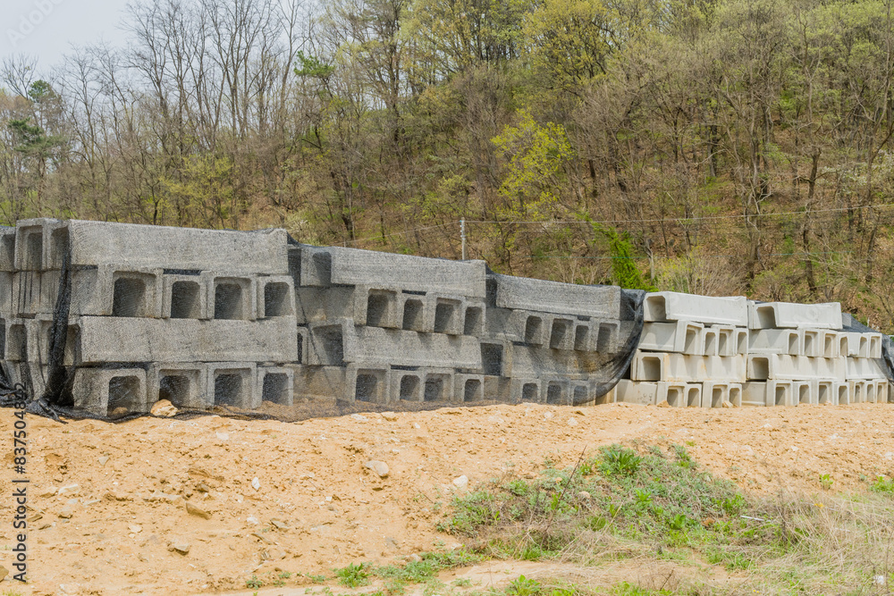 Concrete square culvert sections at base of hillside at rural ...