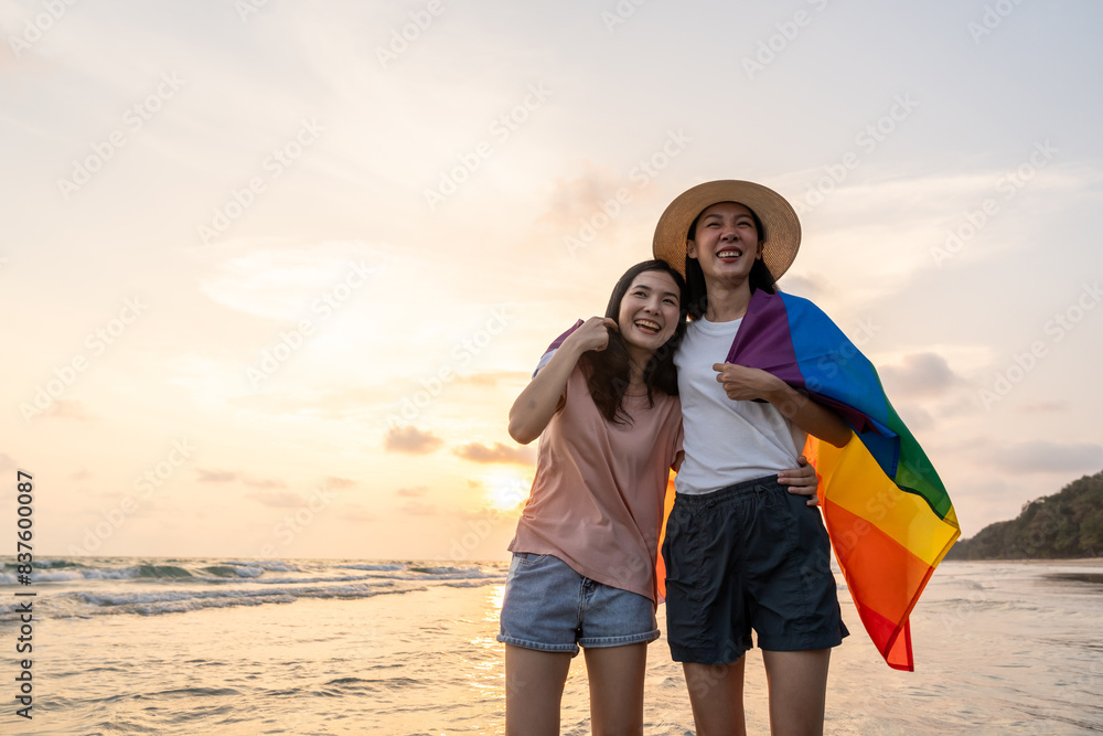 Young couple asian lesbian with pride movement LGBT holding rainbow ...