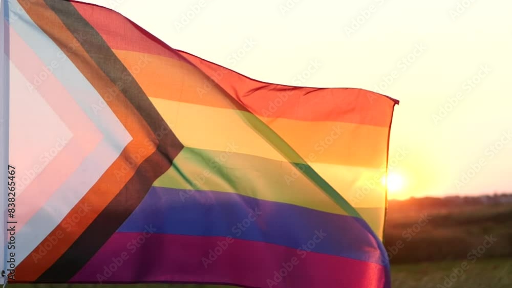 LGBT Pride Month. New LGBT flag waving against the wind, beautiful ...