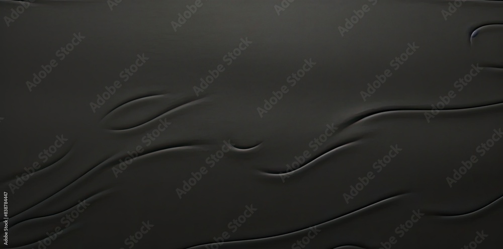 rubberized texture of a black leather surface with a curved line and a ...