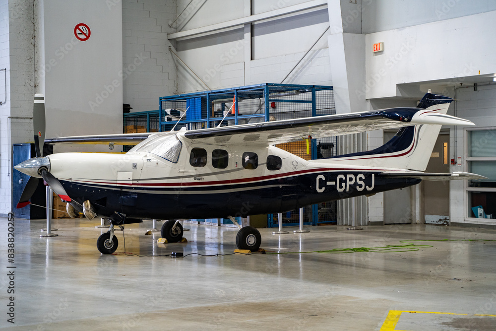 Light aircraft in the hangar. The Cessna 210 Centurion is a six-seat ...