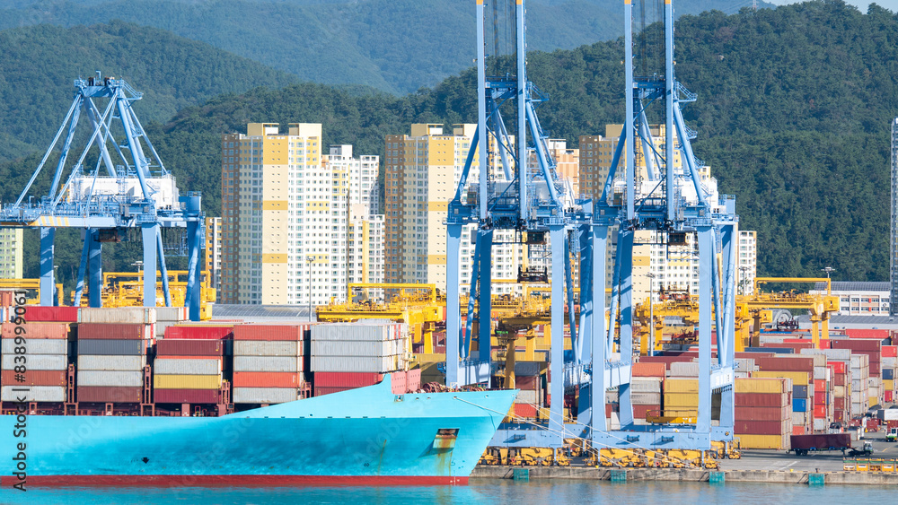 Forward part of container vessel with blue hull has loading and ...