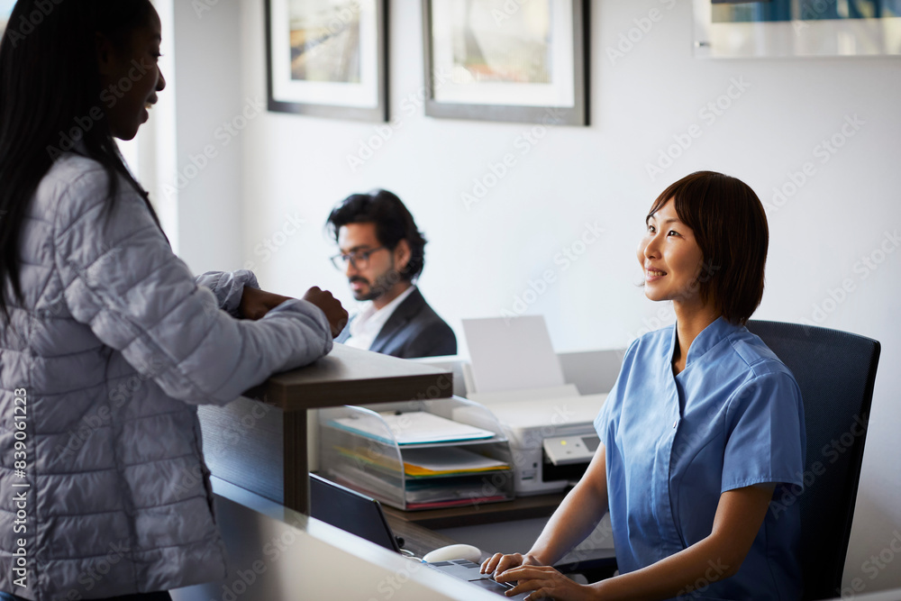 Patient at reception desk of a dental practice Stock Photo | Adobe Stock