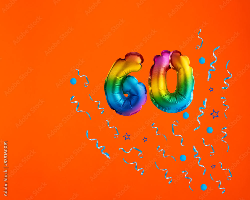 Confetti explosion with number 60 balloon - Celebration on orange ...