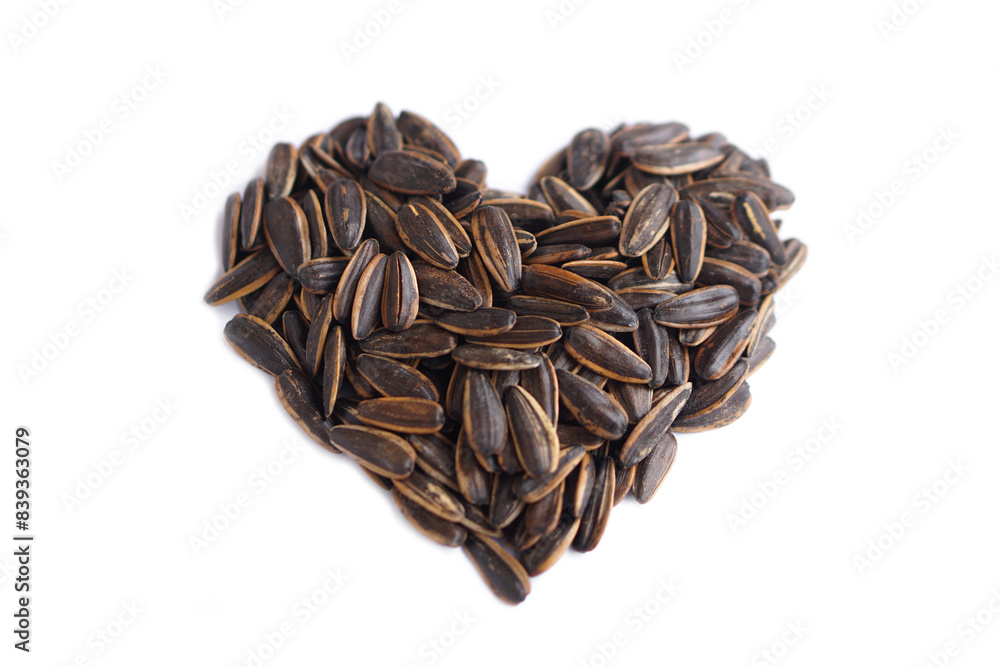 Sunflower seeds, formed in heart shaped, isolated on white background ...