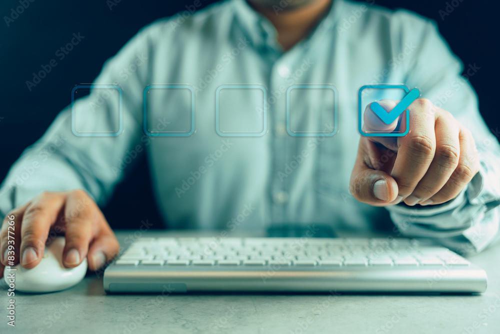 Hand touch the blue tick marking on screen for checklist or to do list ...