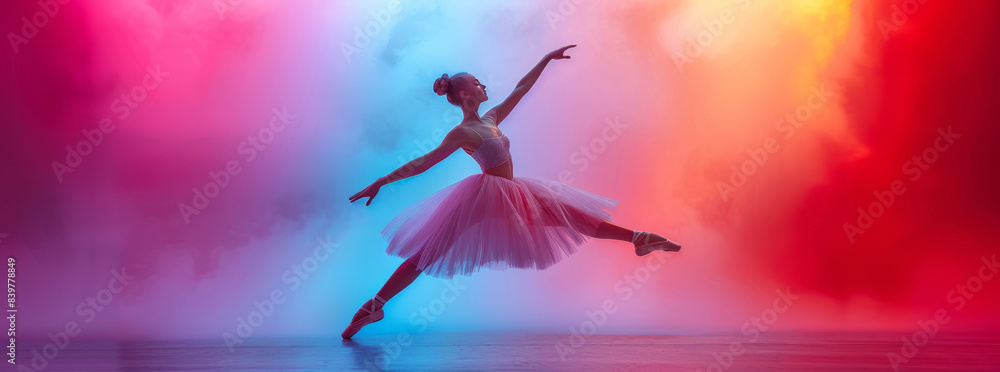 Gorgeous young ballet dancer standing on tiptoe and reaching up in ...