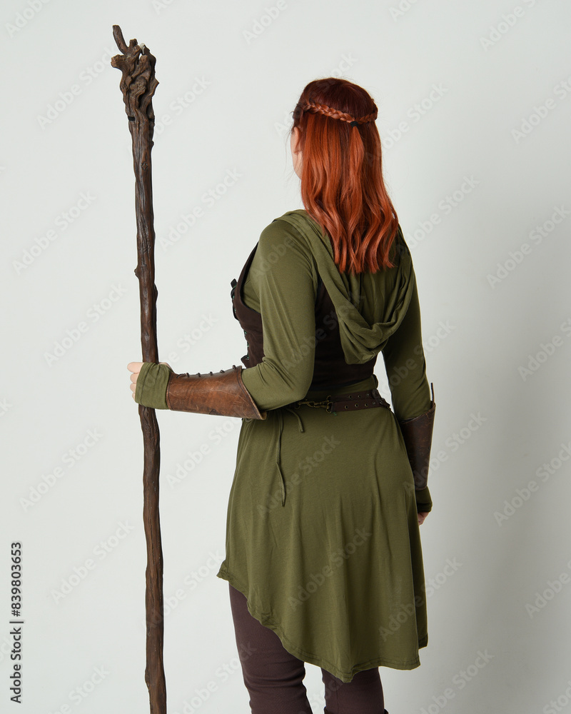 portrait of red haired female model, wearing green medieval fantasy ...