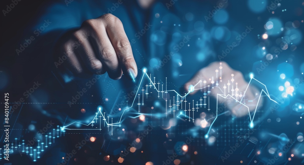 An increasing technical graph is shown on a hand-held touch screen for ...
