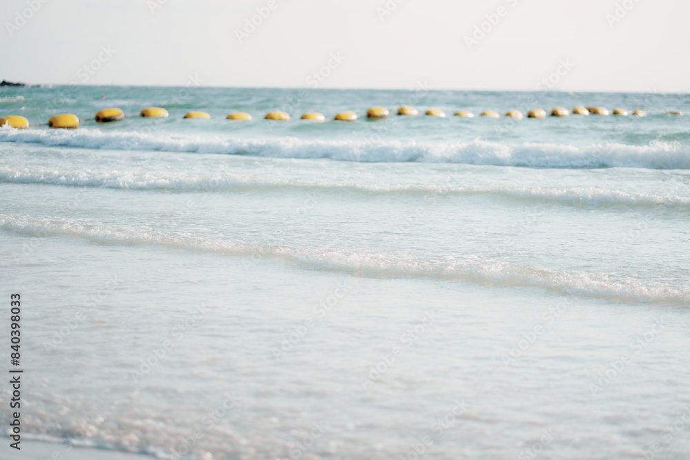 Beach scene in summer with waves and blue sky. Stock Photo | Adobe Stock