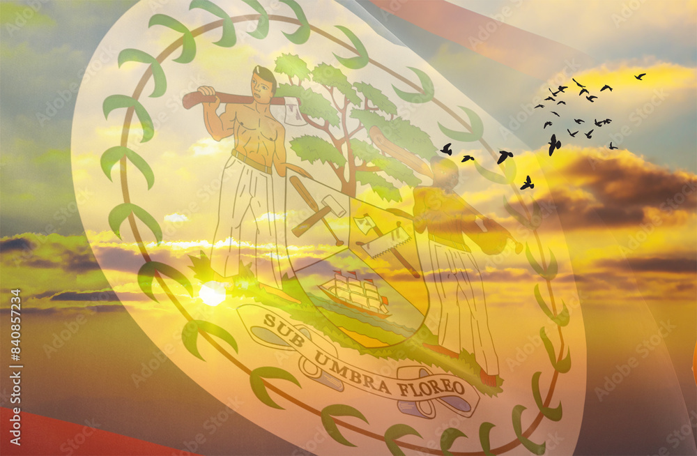 Waving the flag of Belize against the background of a sunset or sunrise ...