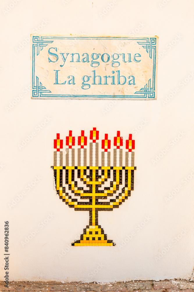 entrance sign with chanukka at historic El Ghriba synagogue in Erriadh ...