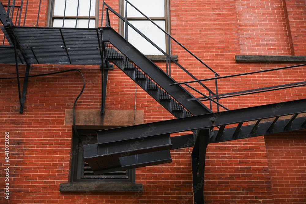 fire escape stairwell on the side of a building, offering a means of ...