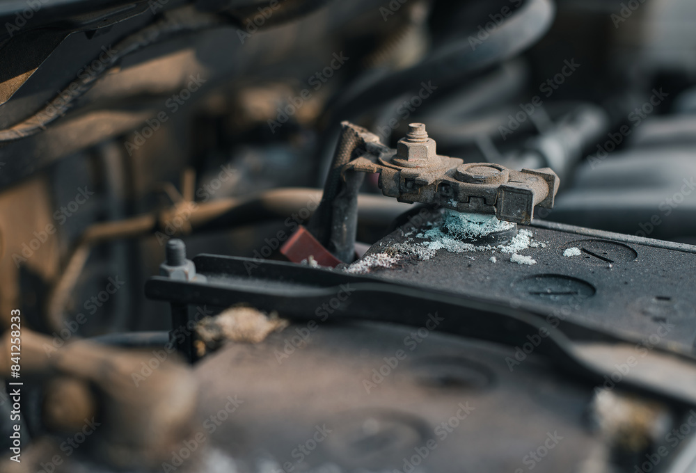 Detailed view of a corroded car battery terminal, highlighting the ...