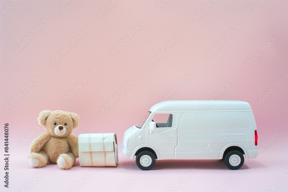 Teddy bear with white toy delivery van on a pale pink background with ...