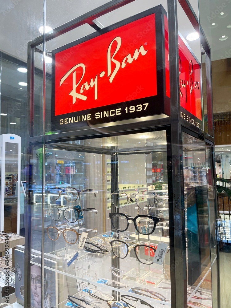 Glass showcase of brand Ray-Ban in optics store. New collection of ...