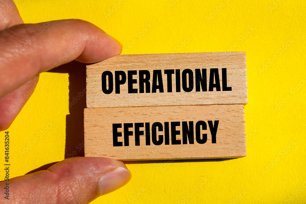 Operational efficiency message written on wooden blocks with yellow ...