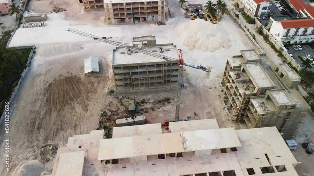 An overhead perspective capturing the construction of a hotel on the ...