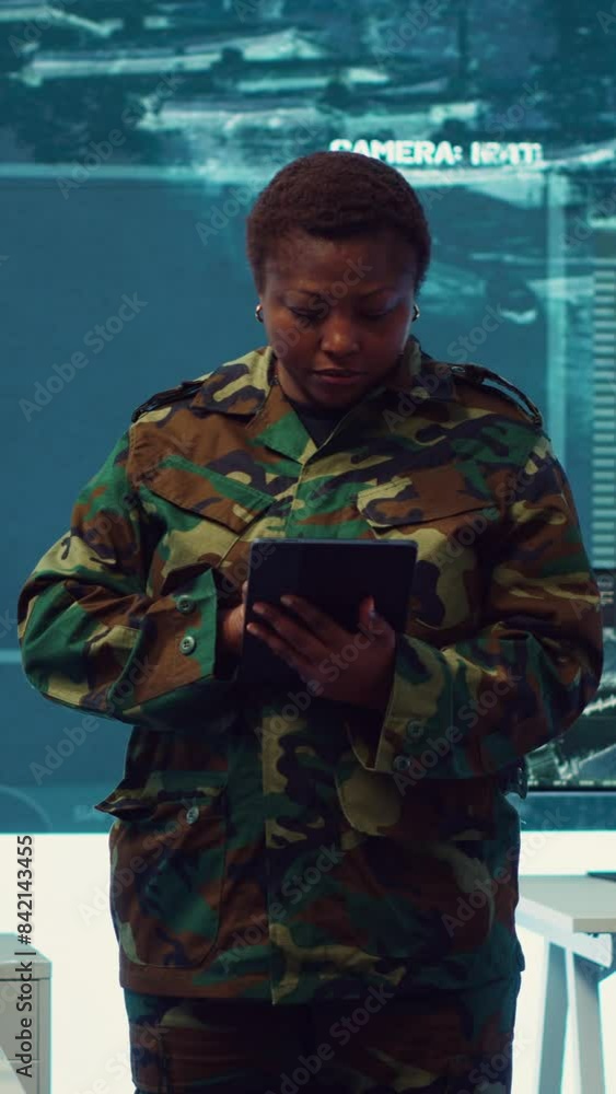 Vertical Video Female military officer supervising radar surveillance ...