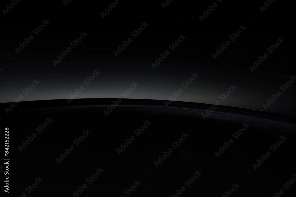 Solid black background with a faint gradient from deep black at the top ...