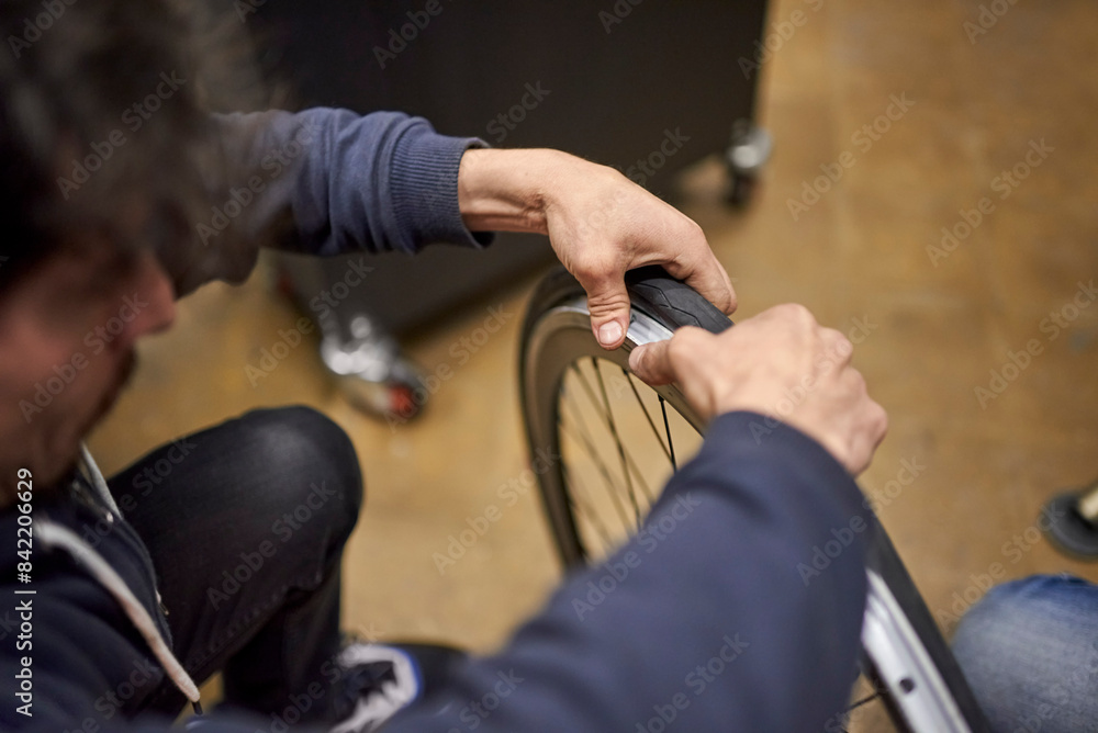 Repairman working: hispanic man concentrated adjusting a bicycle ...