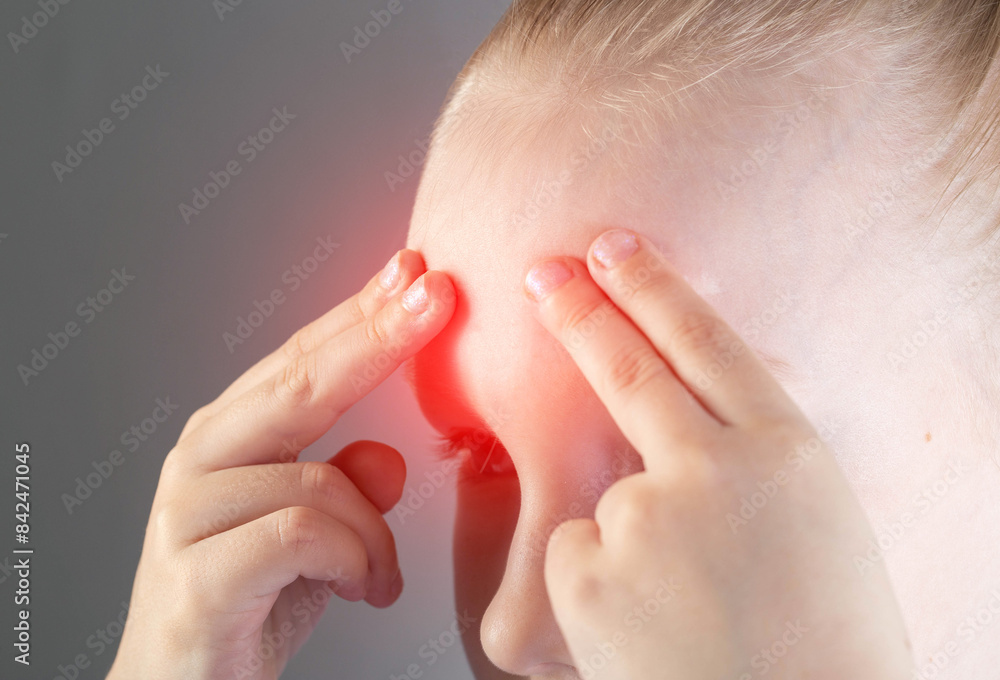 The girl holds her forehead and head with her fingers. Concept of pain ...