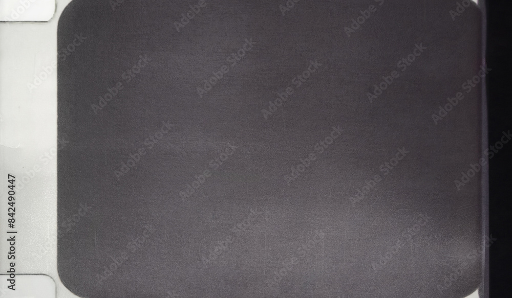 clean blank 16mm film frame with black border, film scan, mock up or ...